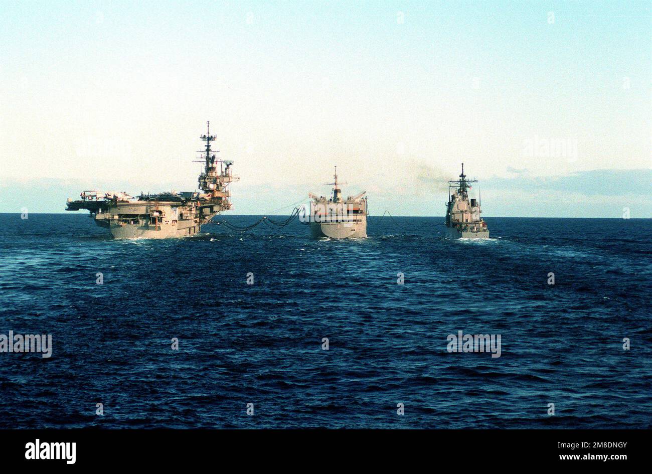The replenishment oiler USS WICHITA (AOR-1), center, conducts an ...