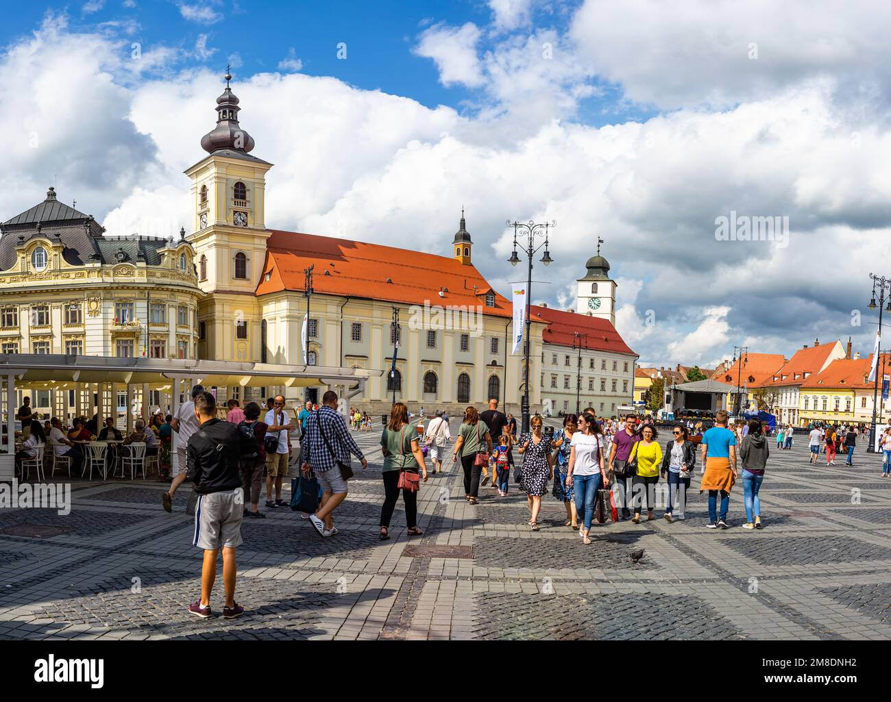 People and tourists wandering on the streets of old town Sibiu, Romania ...