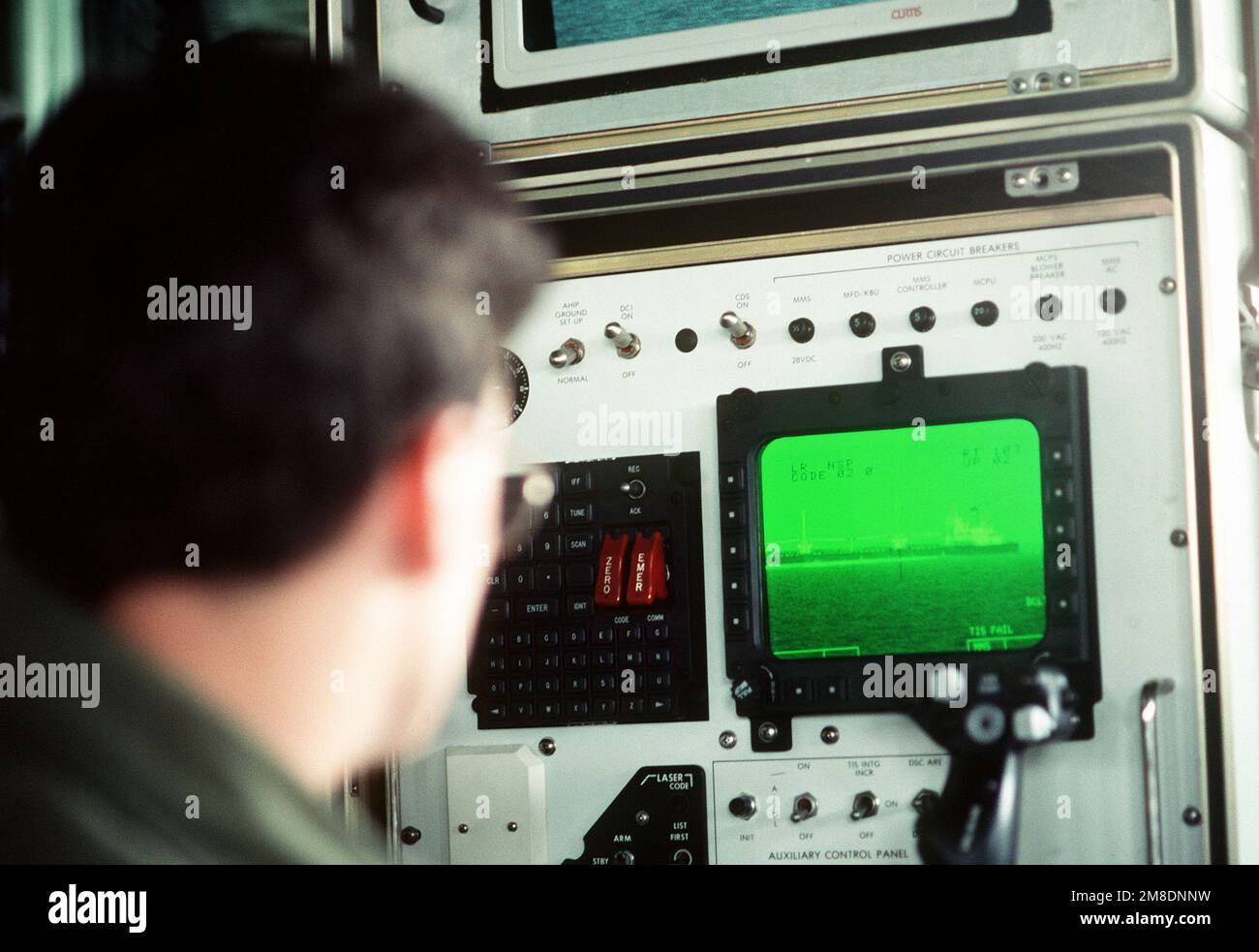 A crew member aboard the guided missile frigate USS ROBERT G. BRADLEY ...