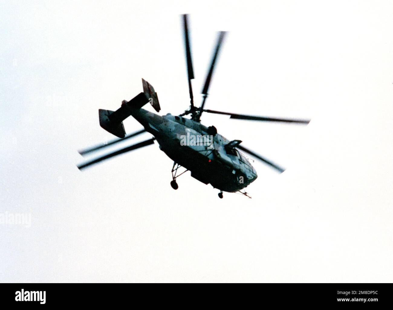 A right underside view of a Soviet Ka-29 Helix B helicopter in flight ...