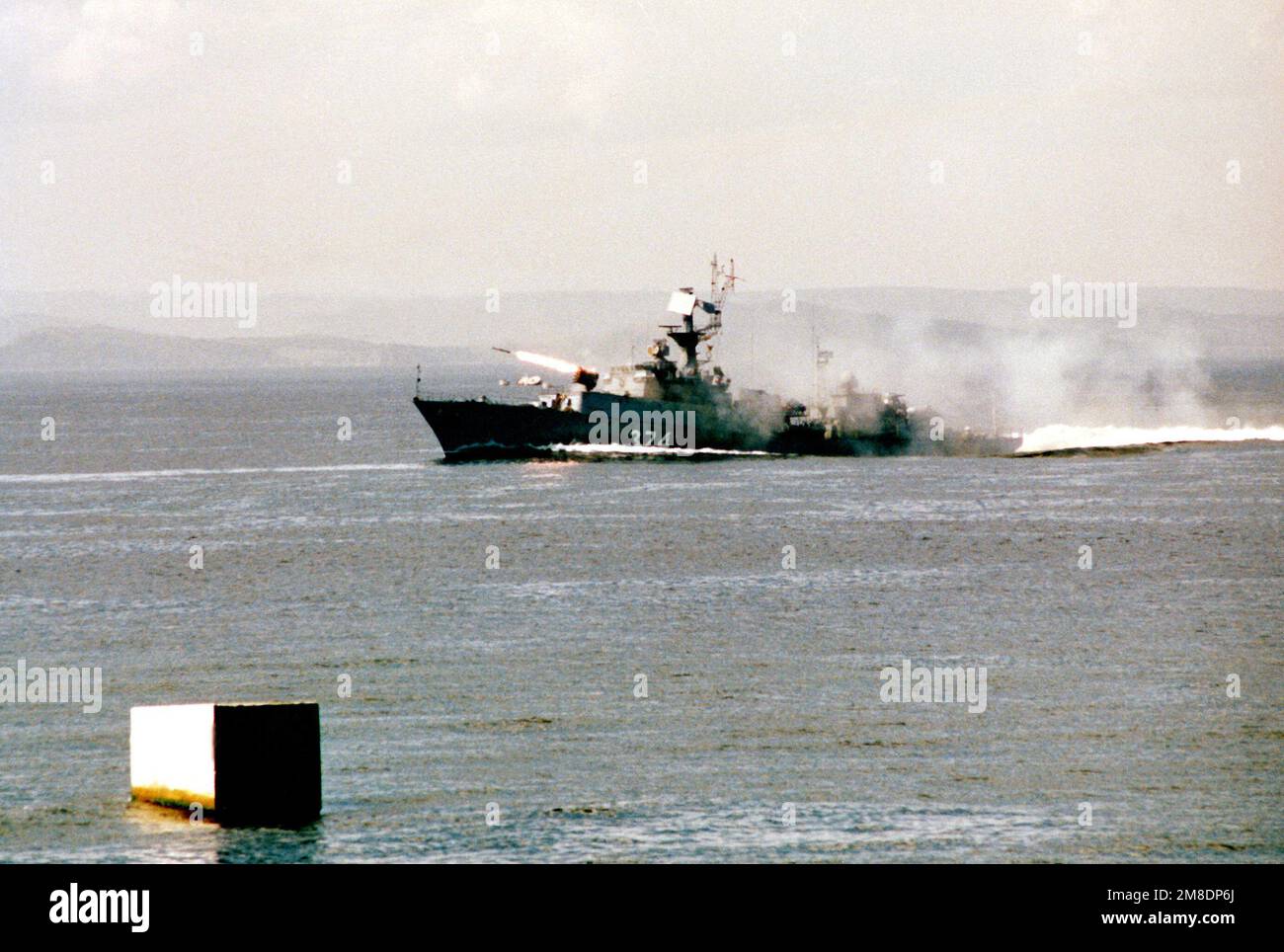 A Soviet Grisha V class light frigate fires a rocket from one of its ...