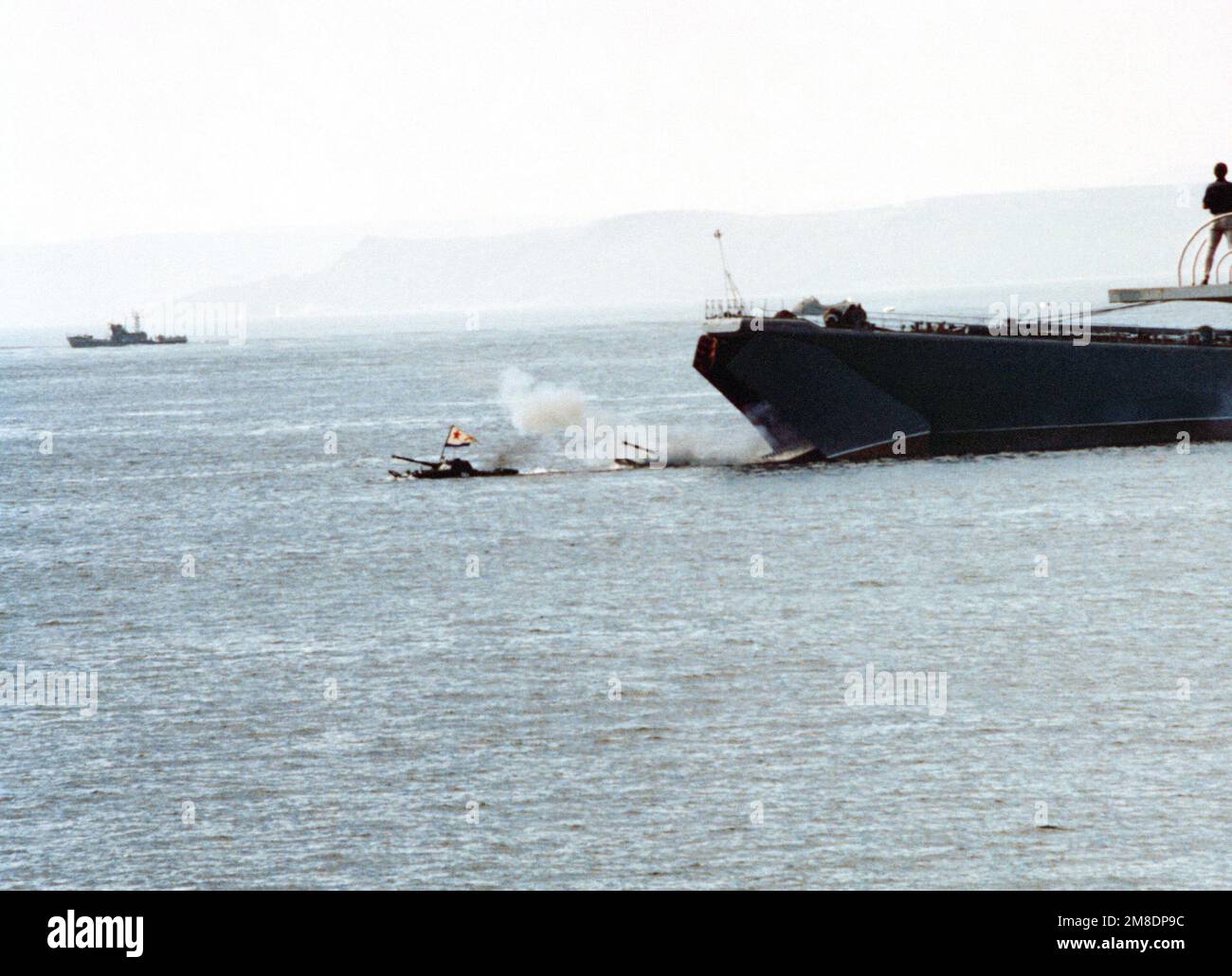 Soviet Naval Infantry PT-76 amphibious tanks emerge from the bow of a ...
