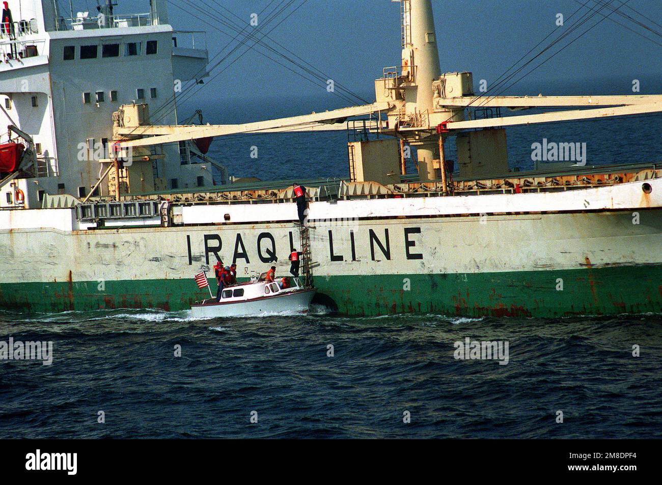 Two members of a boarding team from the guided missile destroyer USS ...