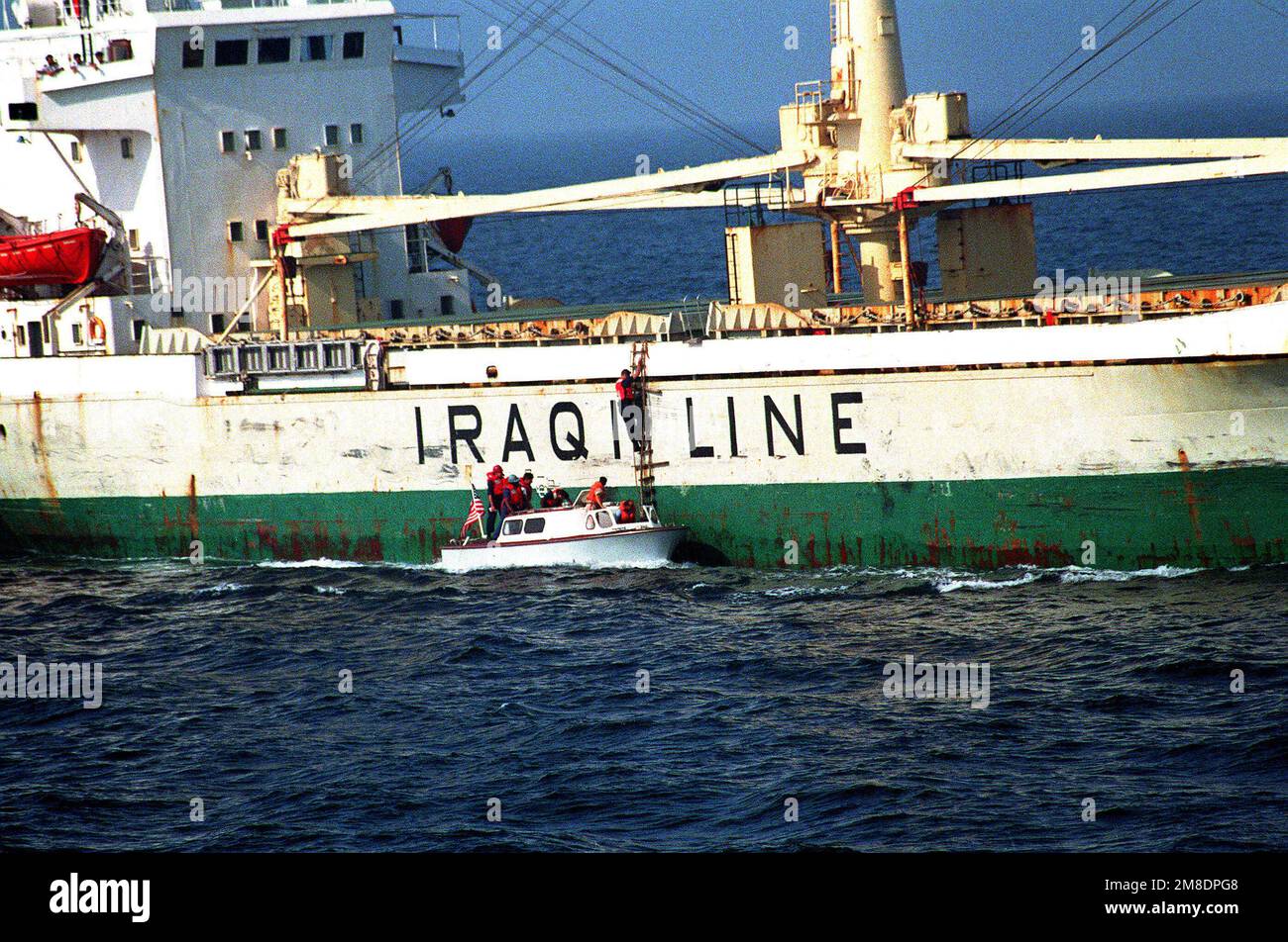 A member of a boarding team from the guided missile destroyer USS ...