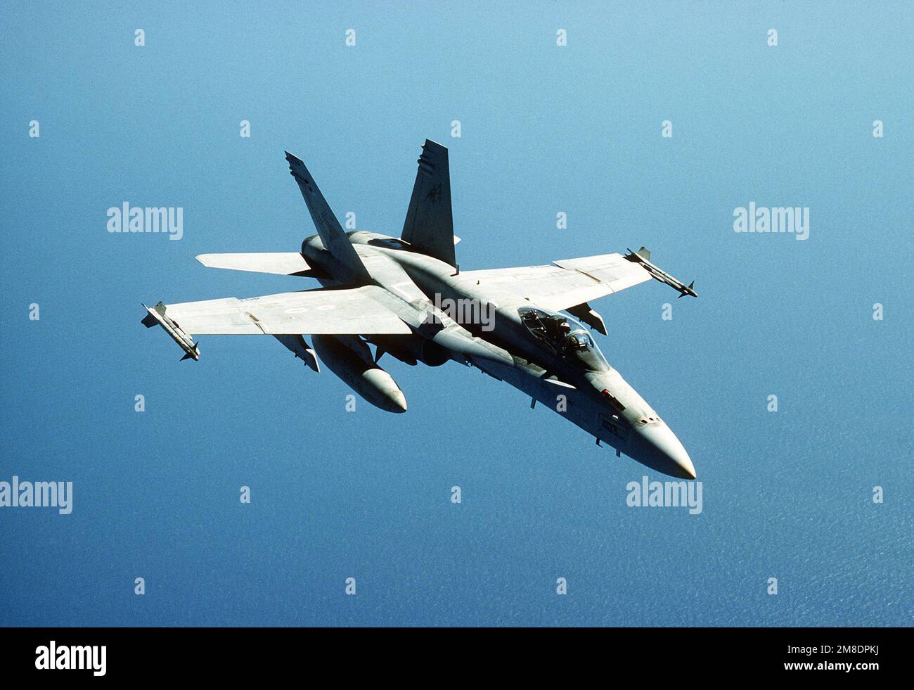 A Strike Fighter Squadron 81 (VFA-81) F/A-18C Hornet aircraft flies ...