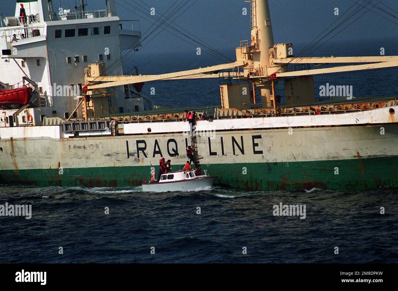 A U.S. Coast Guard boarding crew from the guided missile destroyer USS ...