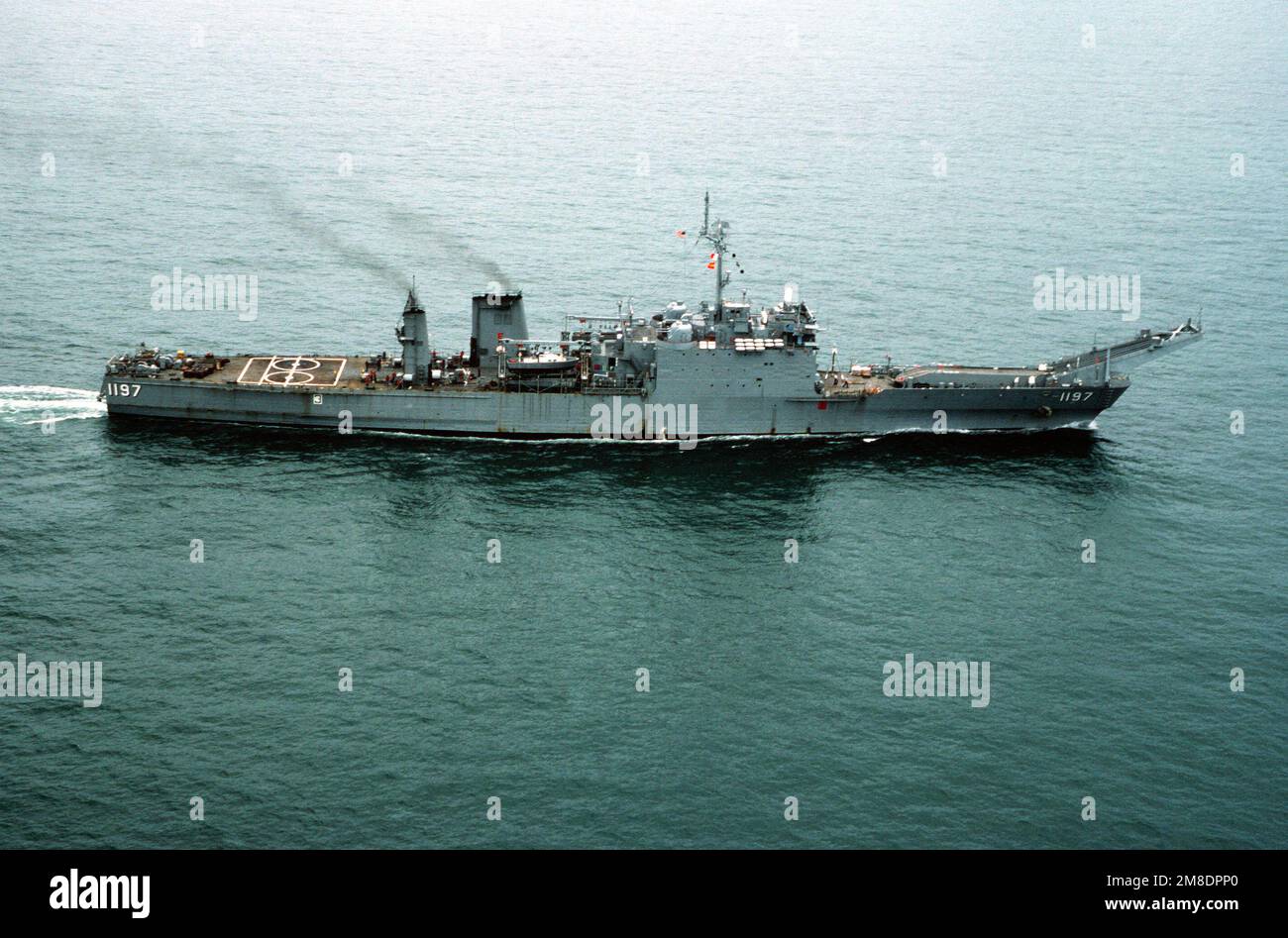 A starboard beam view of the tank landing ship USS BARNSTABLE COUNTY ...