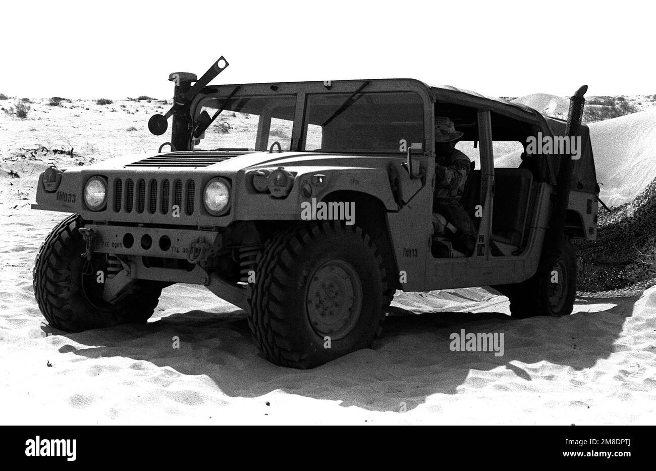 A Marine drives an M998 High-Mobility Multipurpose Wheeled Vehicle ...