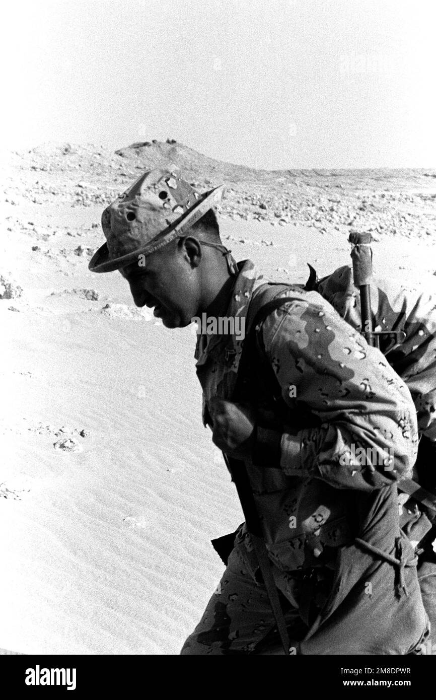 A Marine From 1st Battalion 5th Marines Carries His Gear Near The Battalion Combat Operations
