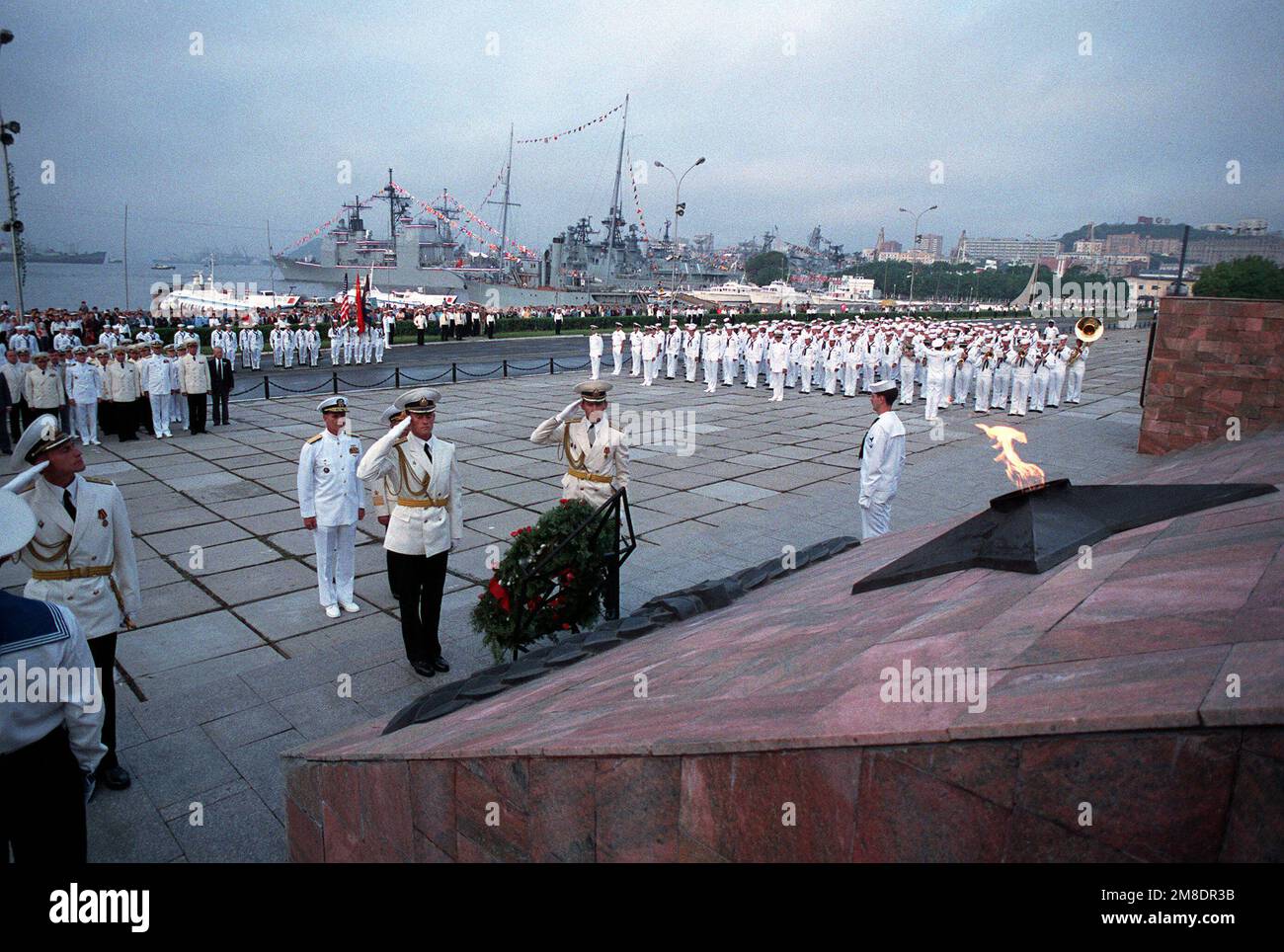 Members of a Soviet navy honor guard salute after laying a wreath to ...