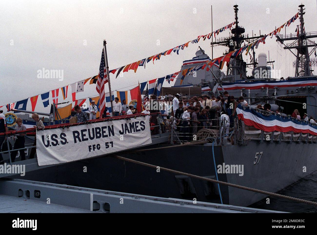 Soviet civilians crowd the stern of the guided missile frigate USS ...