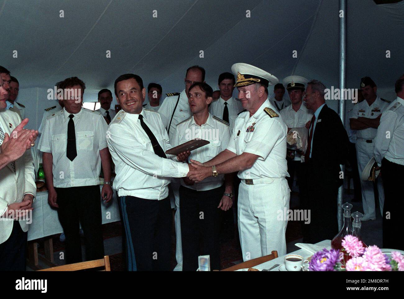 Wearing a Soviet admiral's cap, Vice Admiral John H. Fetterman Jr ...