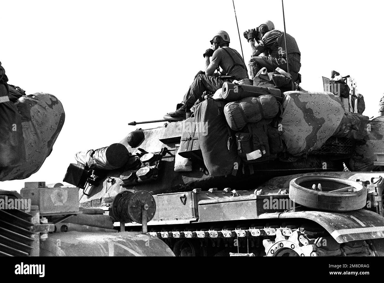 Two Marines from the 1ST Tank Battalion sit atop the turret of their M ...