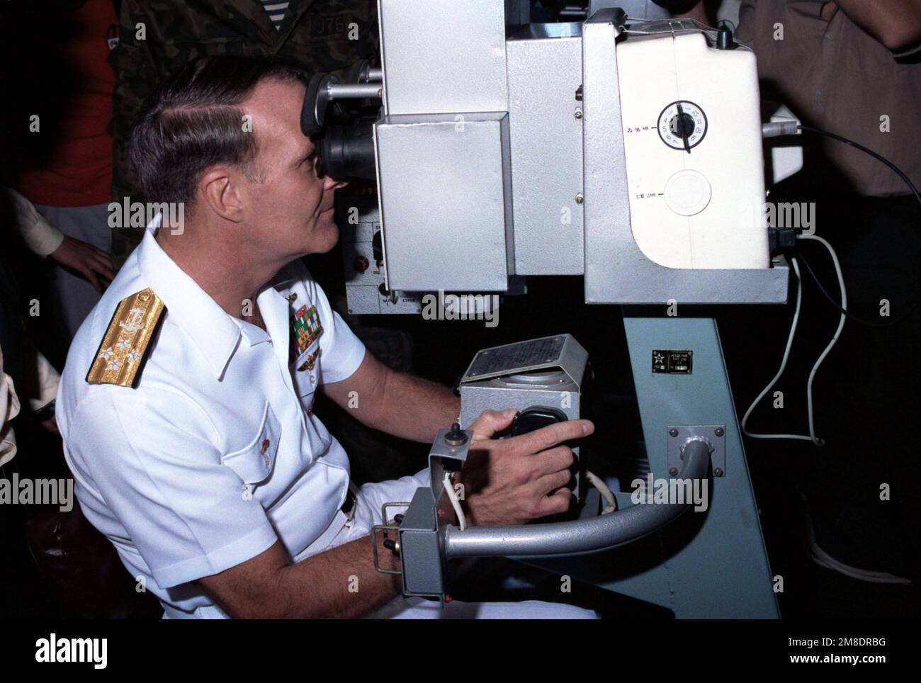 Admiral Charles R. Larson, Commander in CHIEF, US Pacific Fleet, looks ...