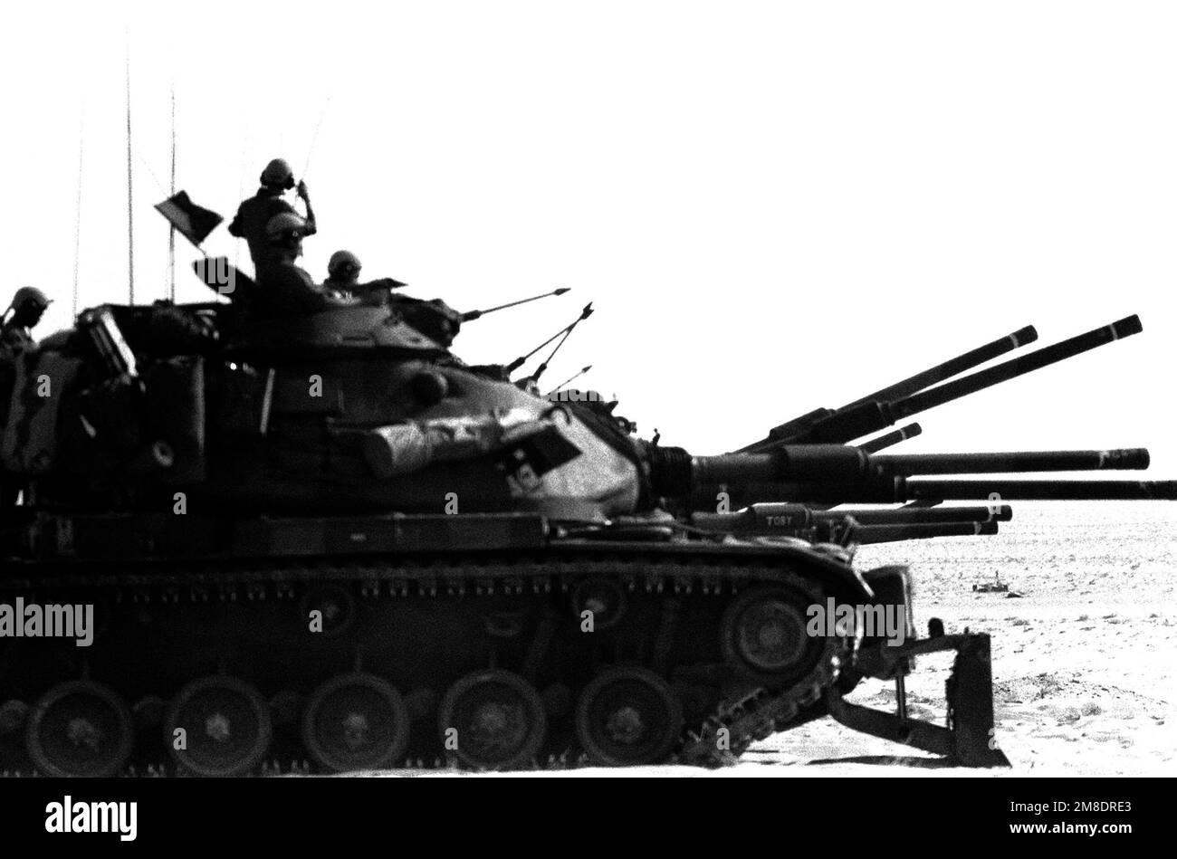 Marines from the 1ST Tank Battalion watch from the turrets of their M ...
