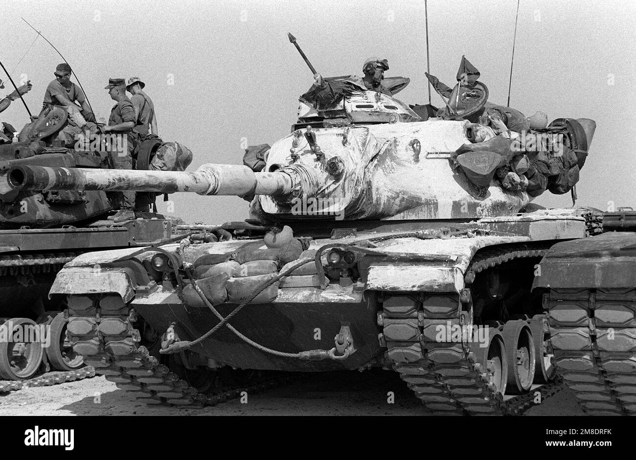 Marines from the 1ST Tank Battalion wait aboard their M-60A1 main ...