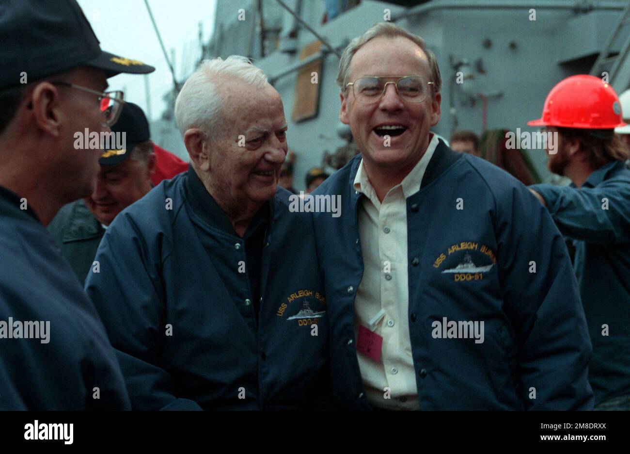 Retired Admiral Arleigh Burke, second from left, shares a laugh with ...