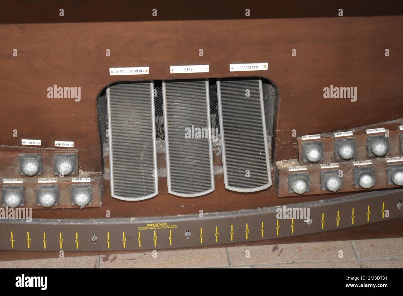The console of a pipe organ, with pistons and combination action ...