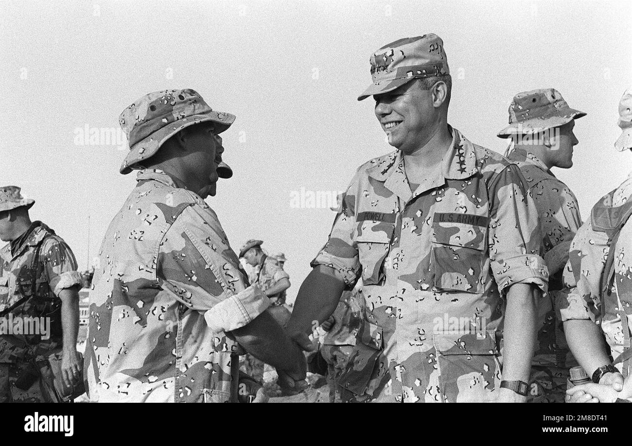 GEN. Colin L. Powell, chairman of the Joint Chiefs of STAFF, greets a ...
