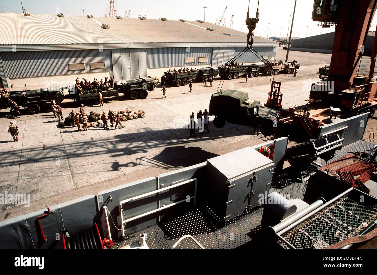 An M-998 high-mobility multipurpose wheeled vehicle is lowered to the ...