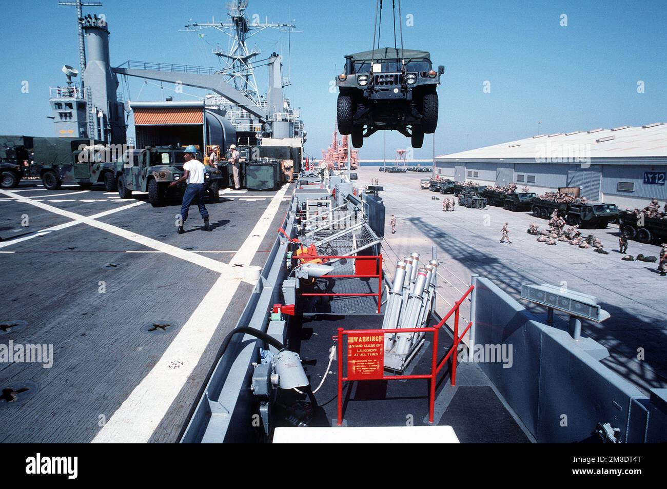 An M-1038 high-mobility multipurpose wheeled vehicle is lifted off of ...