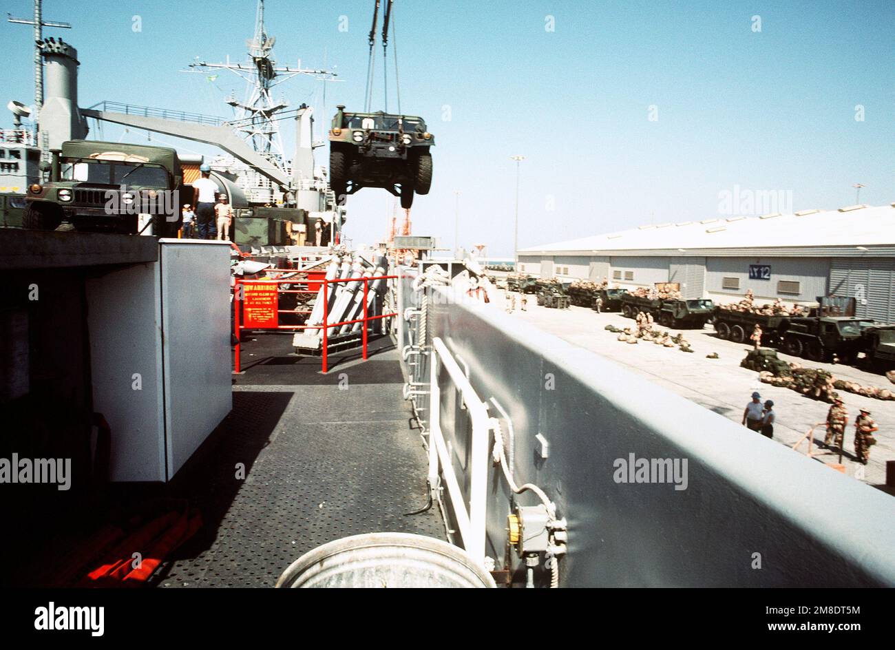 An M-1038 high-mobility multipurpose wheeled vehicle is lifted off of ...