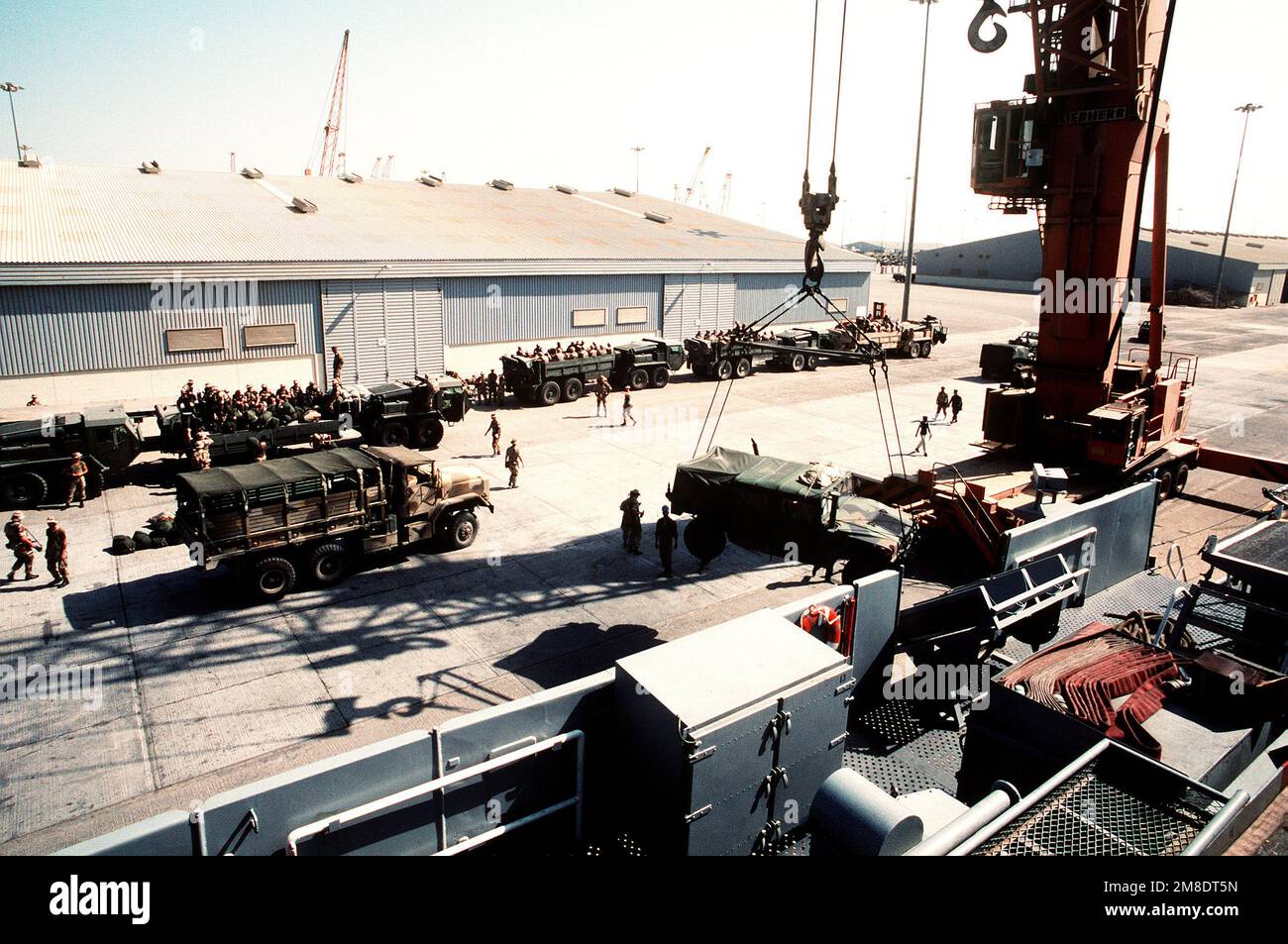 An M-998 high-mobility multipurpose wheeled vehicle is lowered to the ...