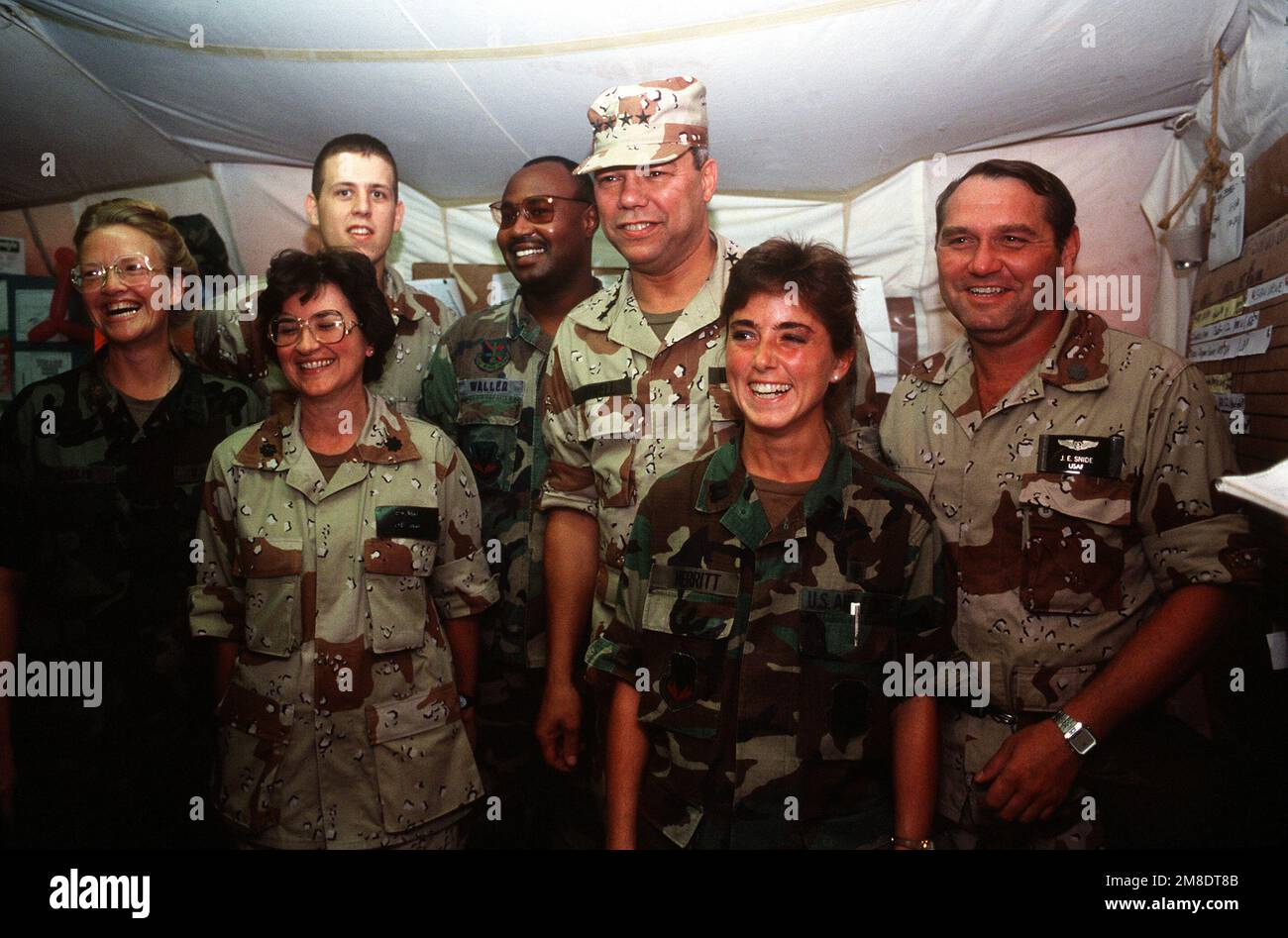 GEN. Colin Powell poses for a group photograph with members of a ...