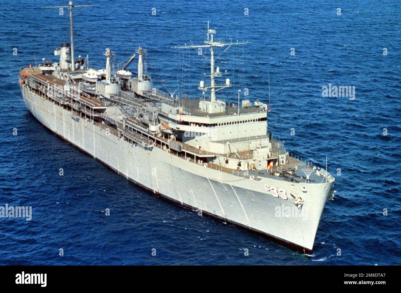 A starboard bow view of the submarine tender USS SIMON LAKE (AS-33 ...