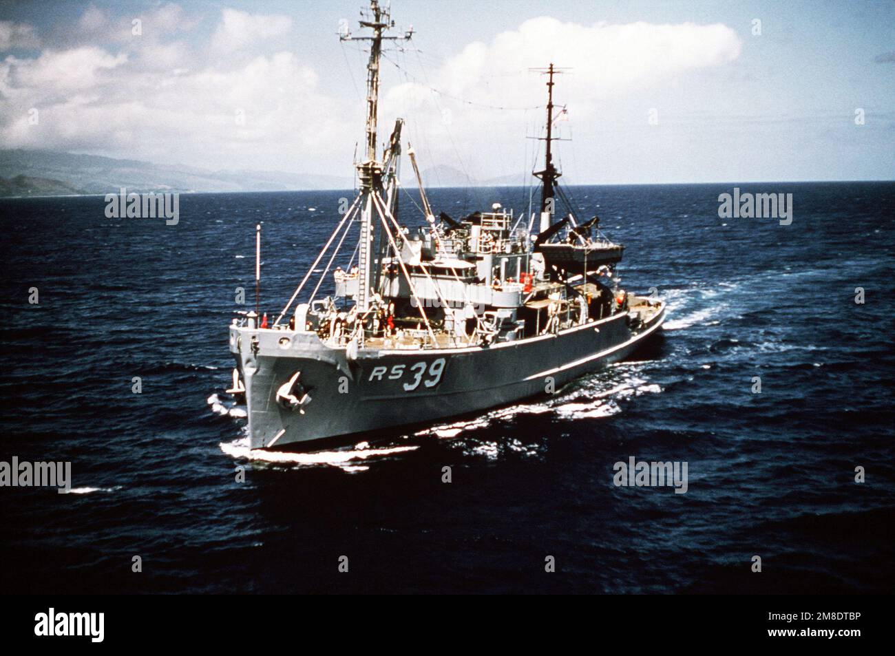 A port bow view of the salvage ship USS CONSERVER (ARS-39) underway off ...