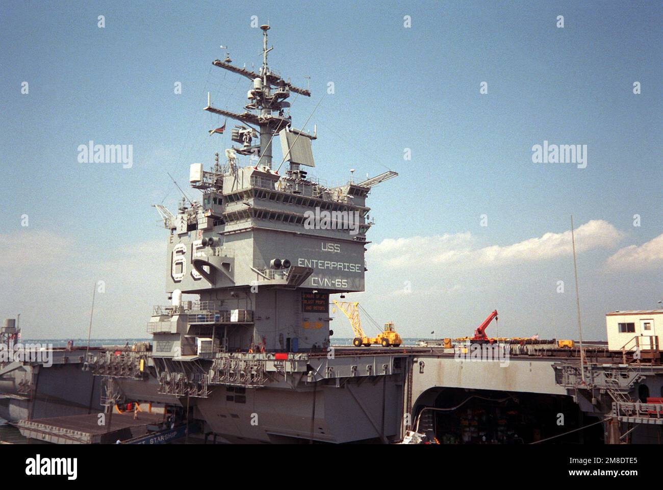 A starboard view of the island of the nuclear-powered aircraft carrier ...