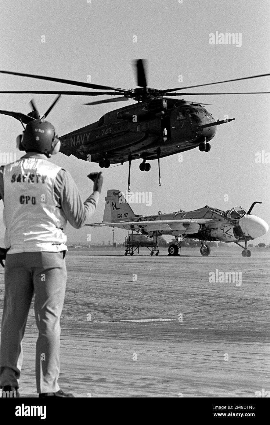 A chief petty officer watches as a Helicopter Combat Support Squadron 1 ...