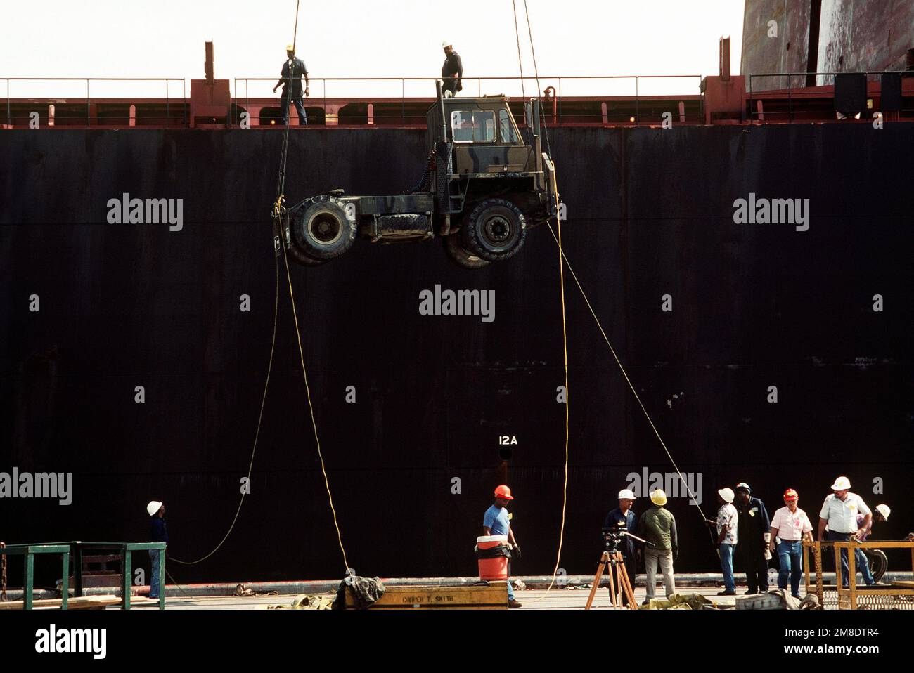 An M-878 tractor truck is loaded aboard the maritime pre-positioning ...