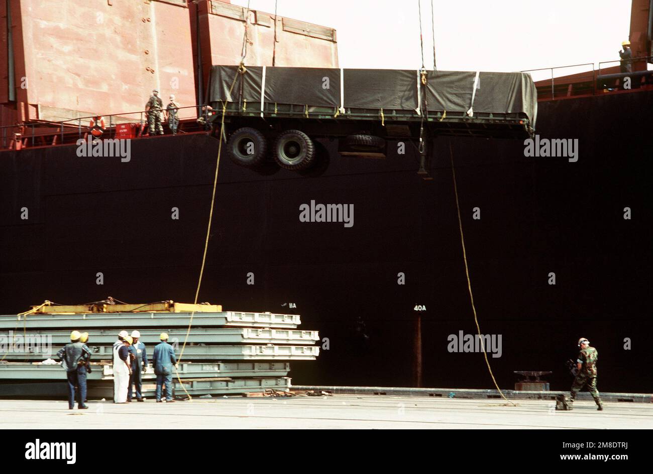 An M-127 12-ton semi-trailer is loaded aboard the maritime pre ...