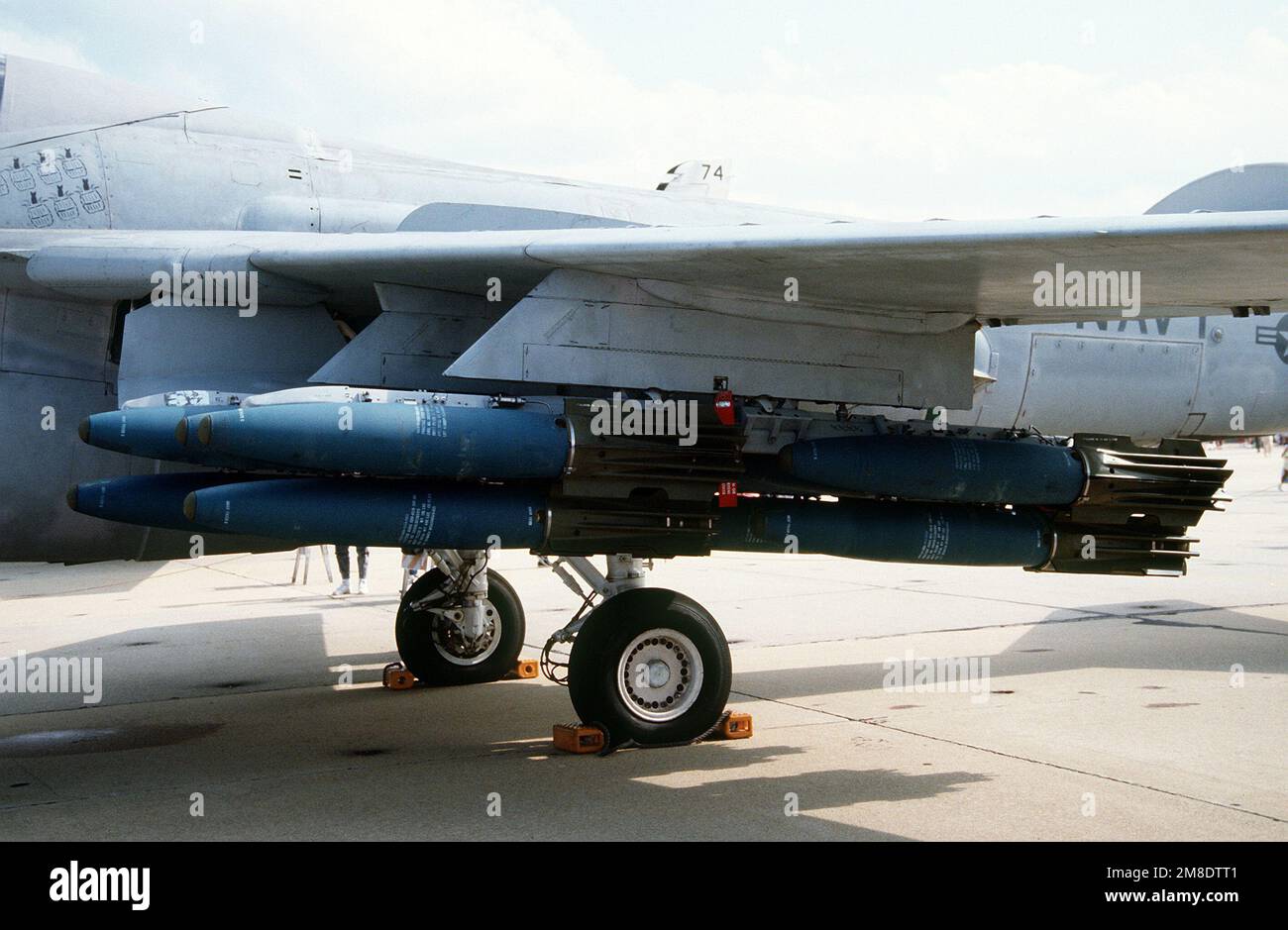 A view of several BDU-45/B 500-pound practice bombs mounted on the wing ...
