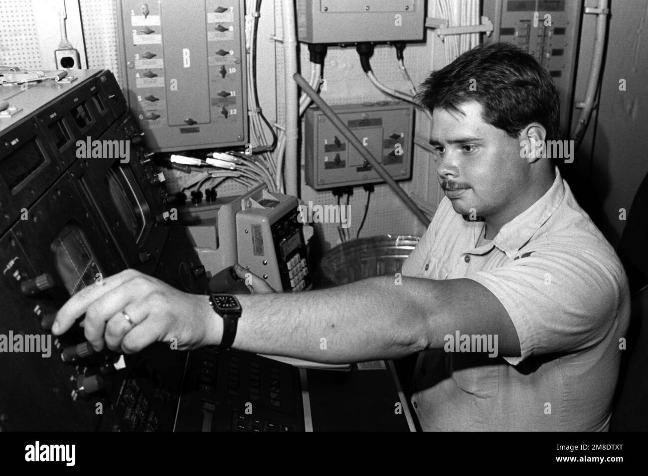 Fire Control Technician 3rd Class Dean Defreitas stands watch at the ...