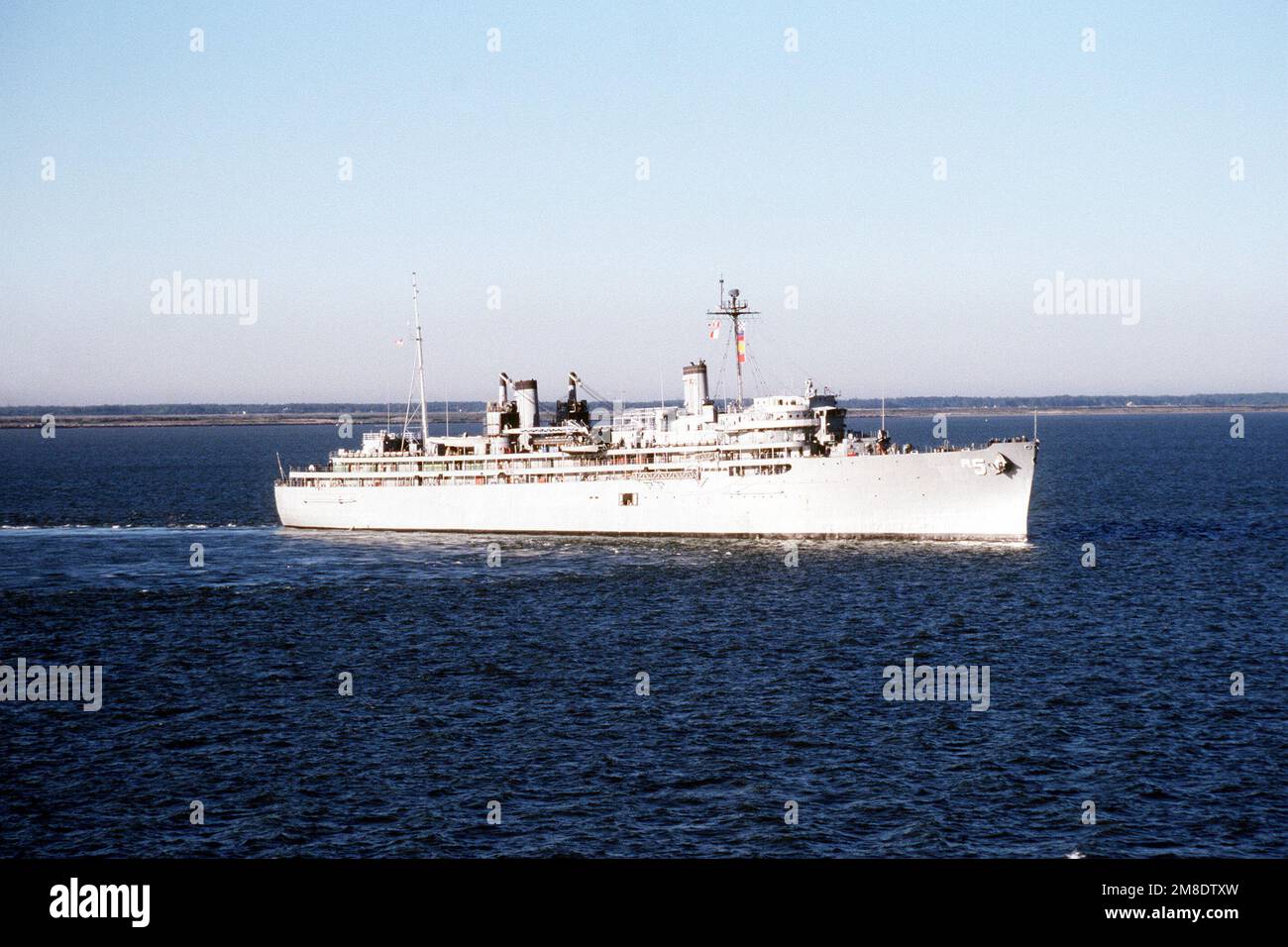 A starboard view of the repair ship USS VULCAN (AR-5) underway as it ...
