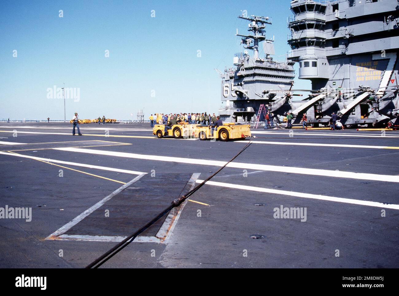 Crew members use MD-3A tow tractors to test the tension level of ...