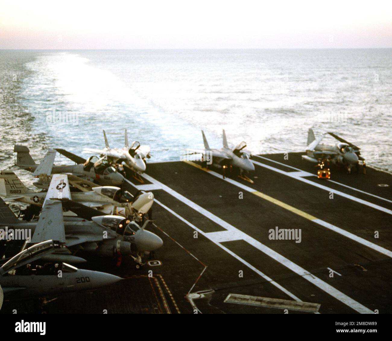 Various aircraft of Carrier Air Wing 11 (CVW-11) are readied for night ...