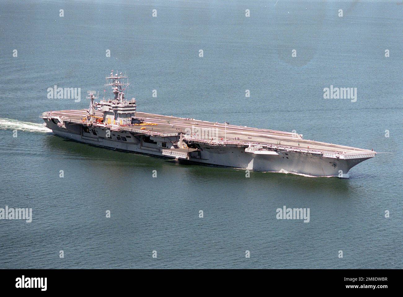 A starboard bow view of the nuclear-powered aircraft carrier USS ...