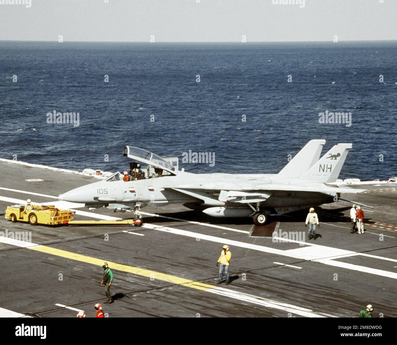An MD-3A tow tractor is used to move a Fighter Squadron 114 (VF-114) F ...