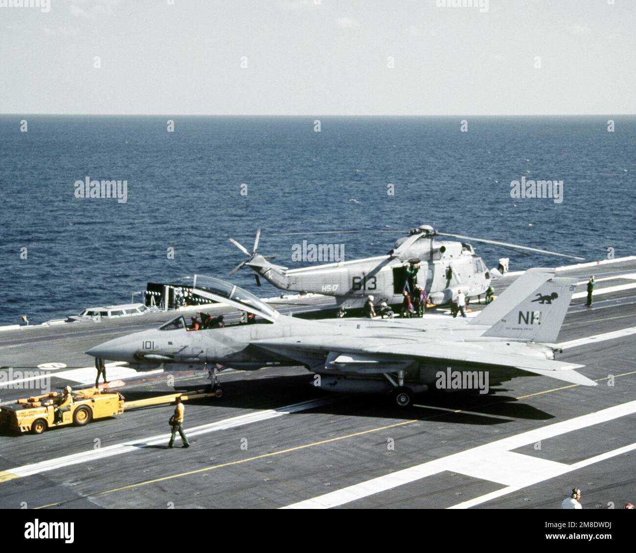 An MD-3A tow tractor is used to move a Fighter Squadron 114 (VF-114) F ...