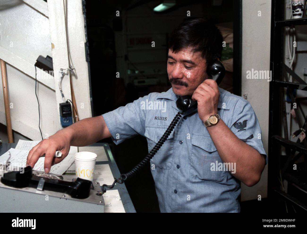 A petty officer in a supply office aboard the aircraft carrier USS JOHN ...