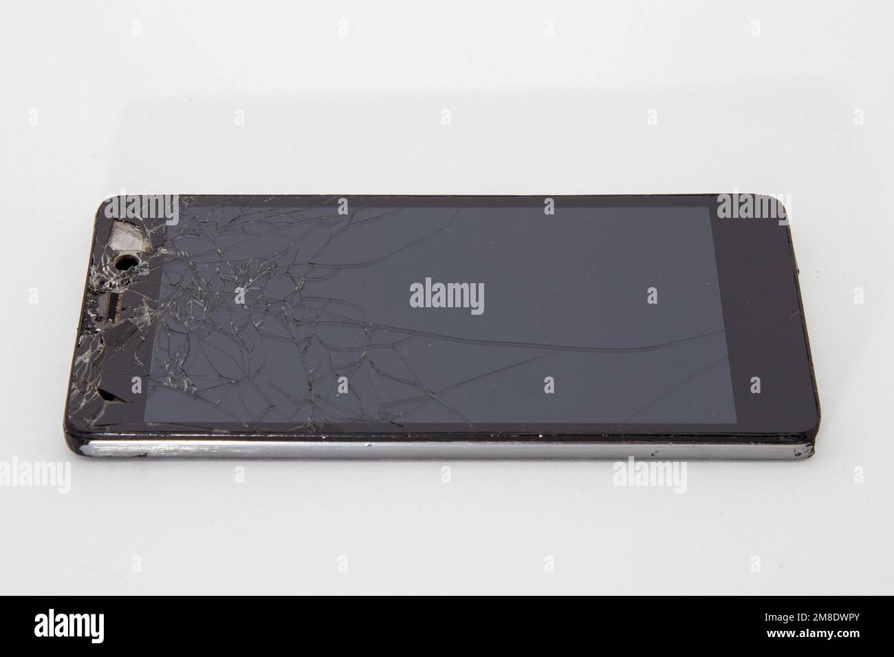 Broken mobile phone, parts and components Stock Photo - Alamy