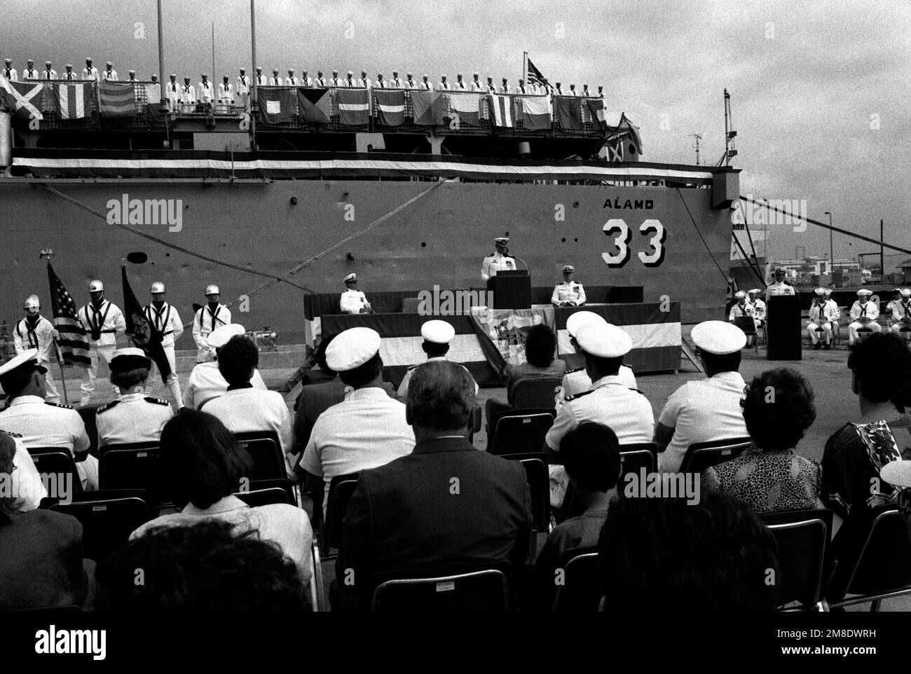 Guests listen to Captain Andrew J. Murphy, Commander, Amphibious ...