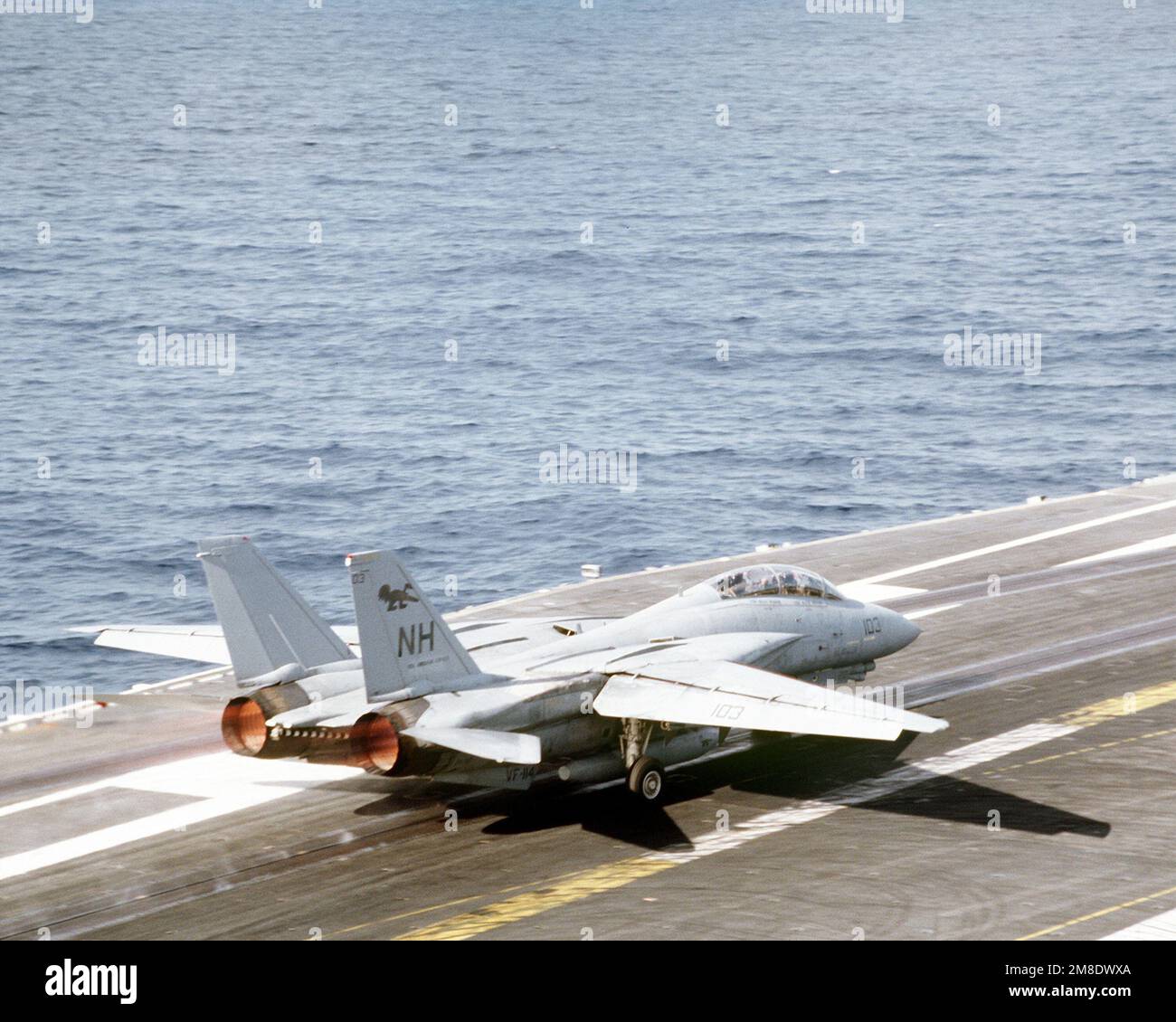 A Fighter Squadron 114 (VF-114) F-14A Tomcat aircraft is launched from ...