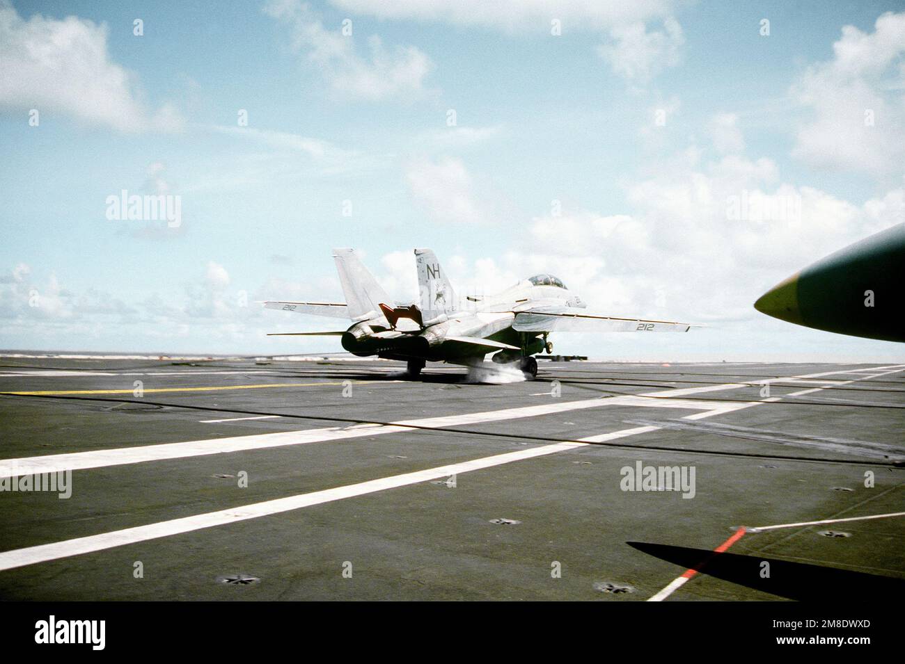 A Fighter Squadron 213 (VF-213) F-14A Tomcat aircraft catches the No. 2 ...