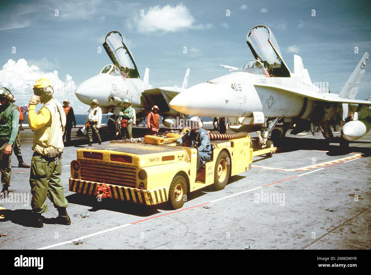 Flight deck crewmen aboard the nuclear-powered aircraft carrier USS ...