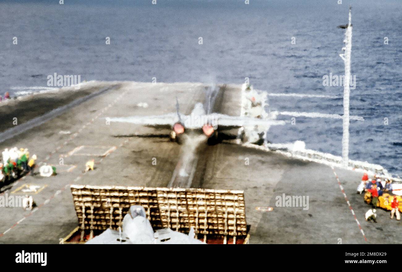 Heat waves envelop a Fighter Squadron 114 (VF-114) F-14A Tomcat ...