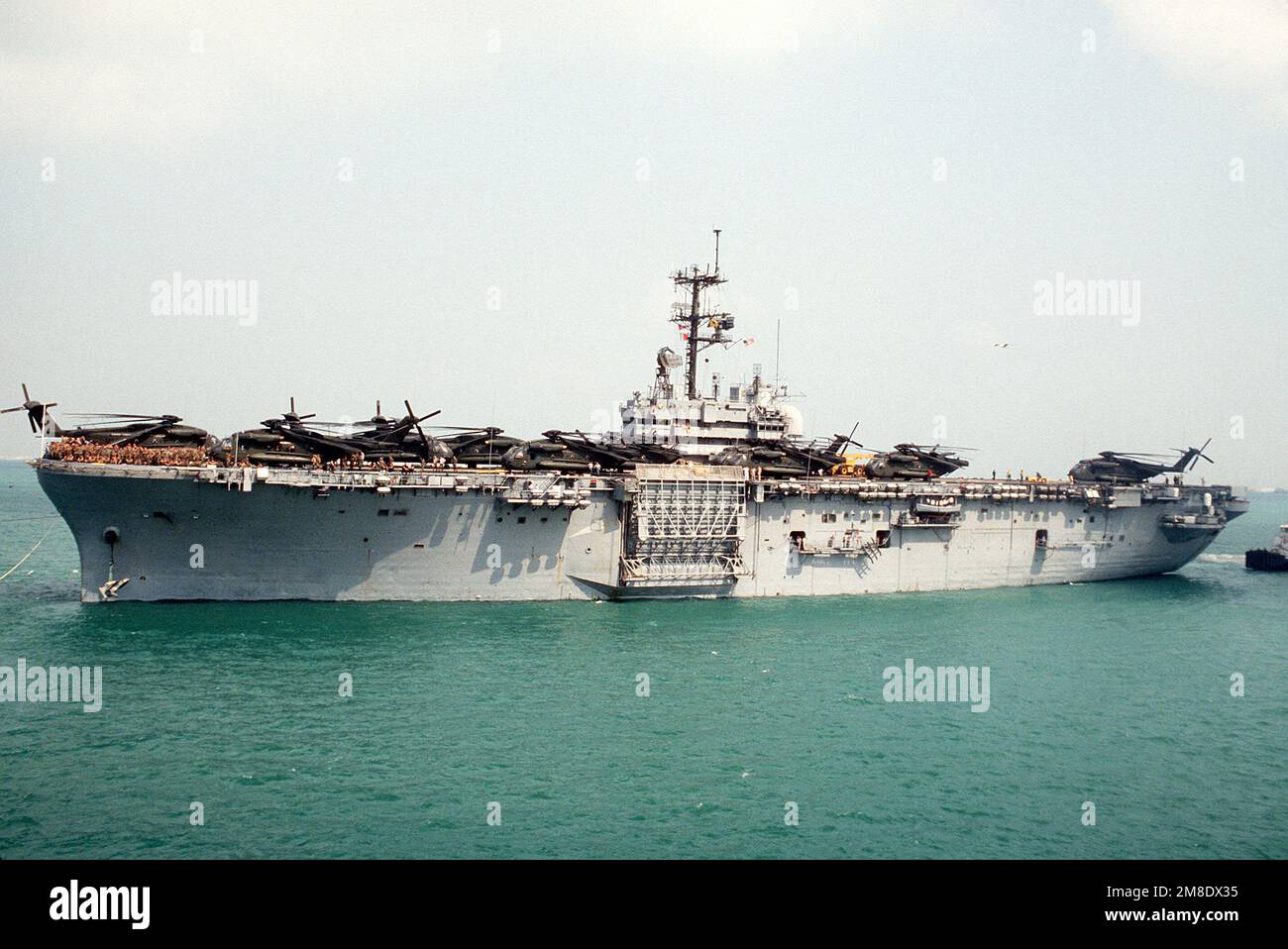 CH-53E Super Stallion helicopters line the flight deck of the ...